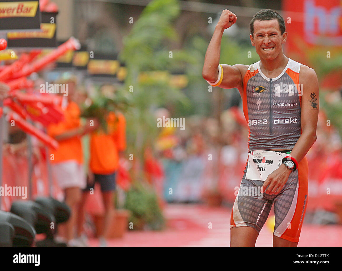 Winner Chris McCormack (Australia) celebrates after winning Ironman ...