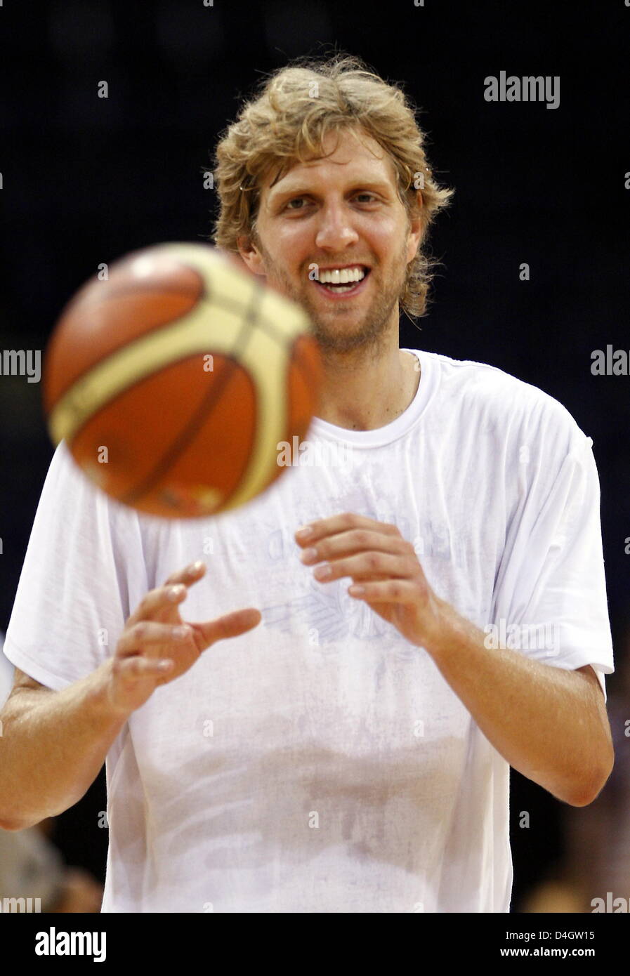 Dirk Nowitzki of Germany's national basketball squad poses with a ball ...