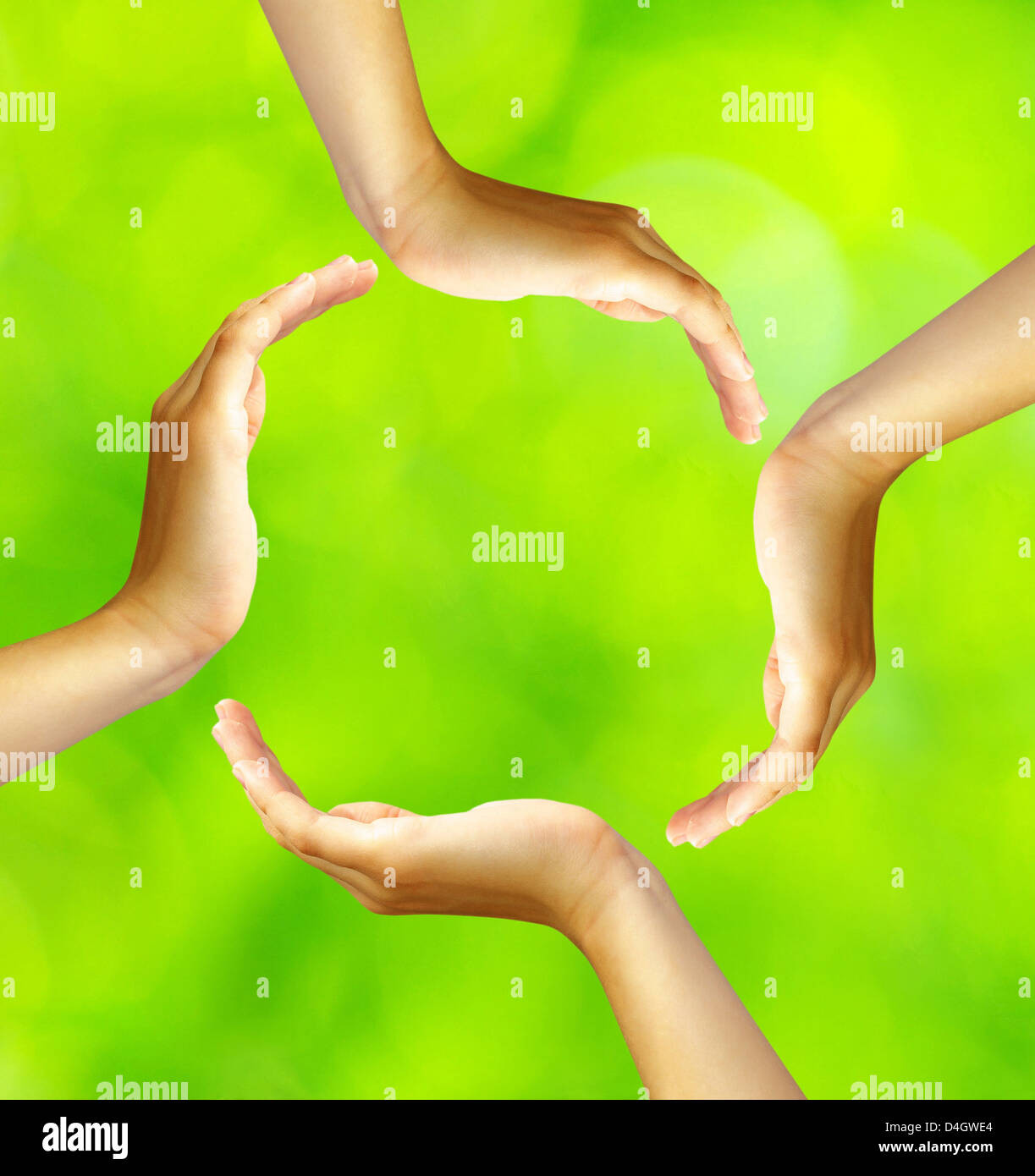 ring of hands isolated on a green Stock Photo - Alamy