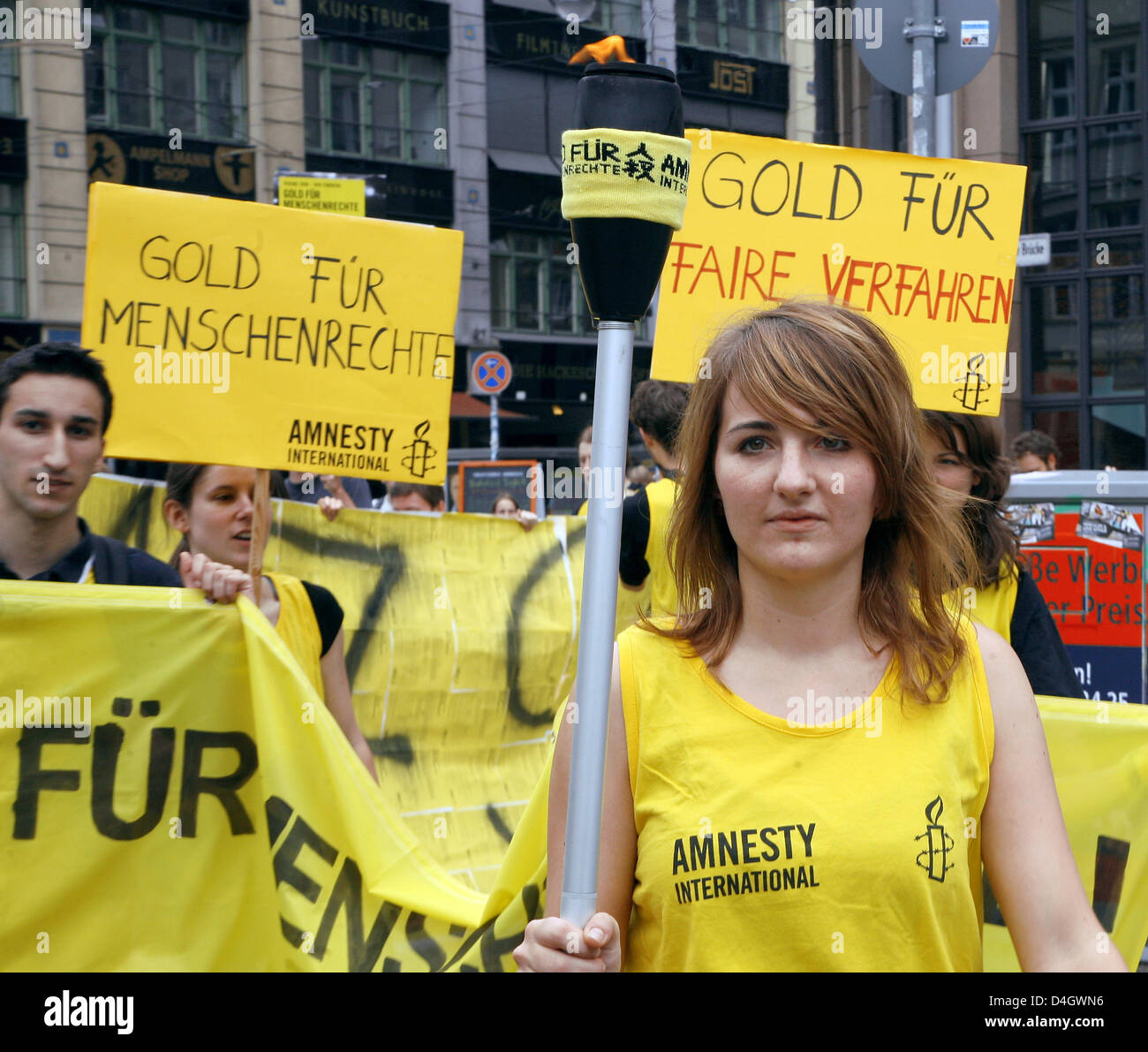 A campaigner of human rights organisation Amnesty International carries ...
