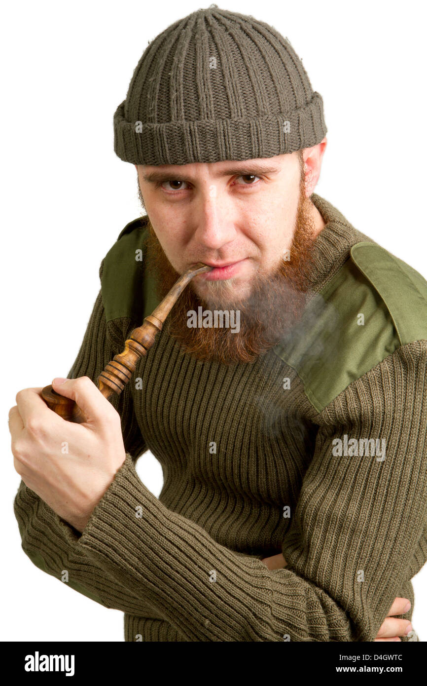 young bearded guy smoking a pipe on a light background Stock Photo - Alamy