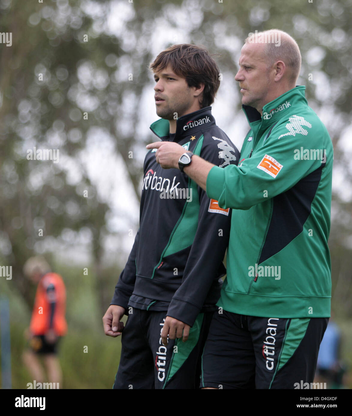 Head coach Thomas Schaaf of Bundesliga club Werder Bremen talks to playmaker Diego during ...