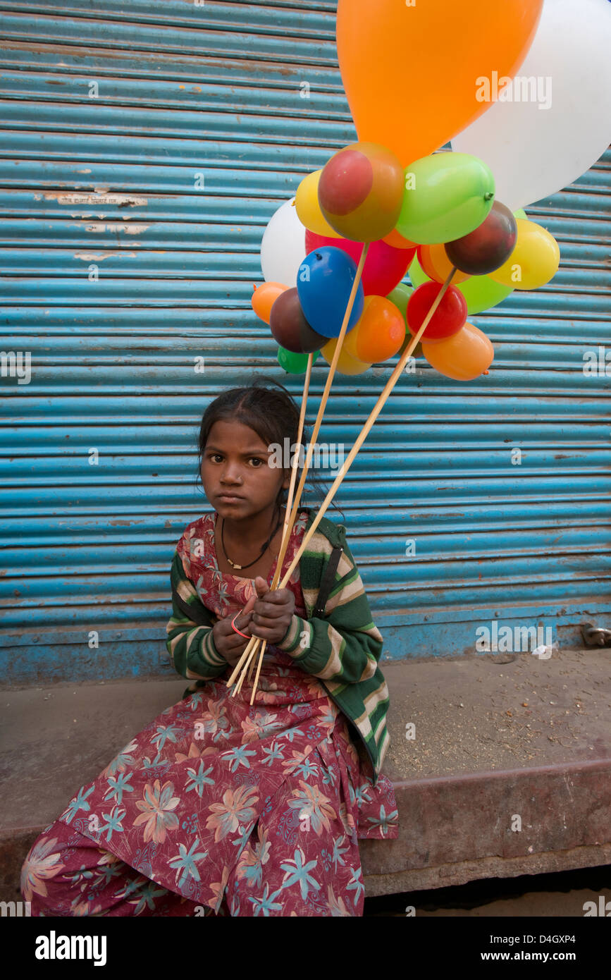 Girl selling balloons hi-res stock photography and images - Alamy