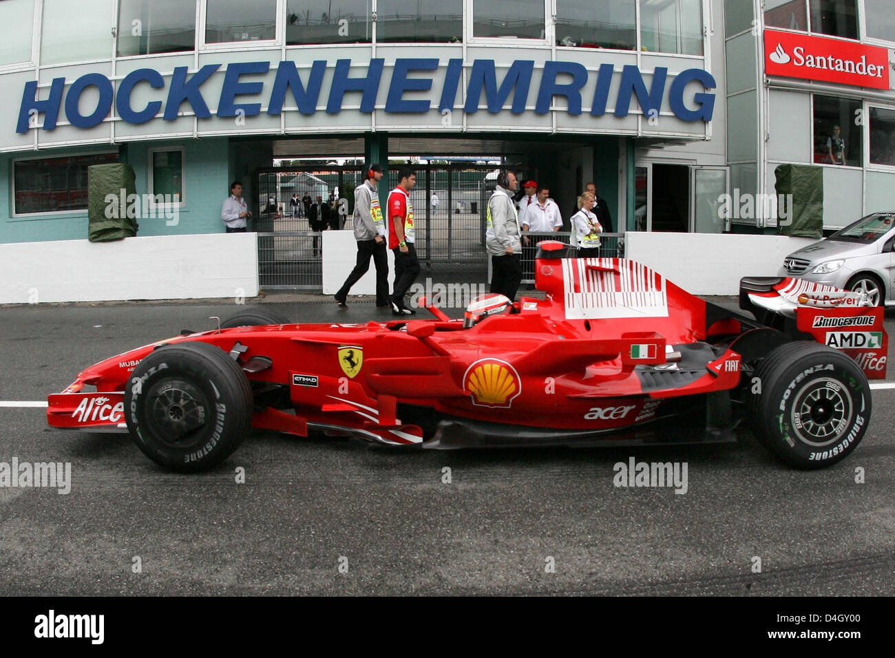 Finnish Formula One driver Kimi Raikkonen of Ferrari steers his car ...