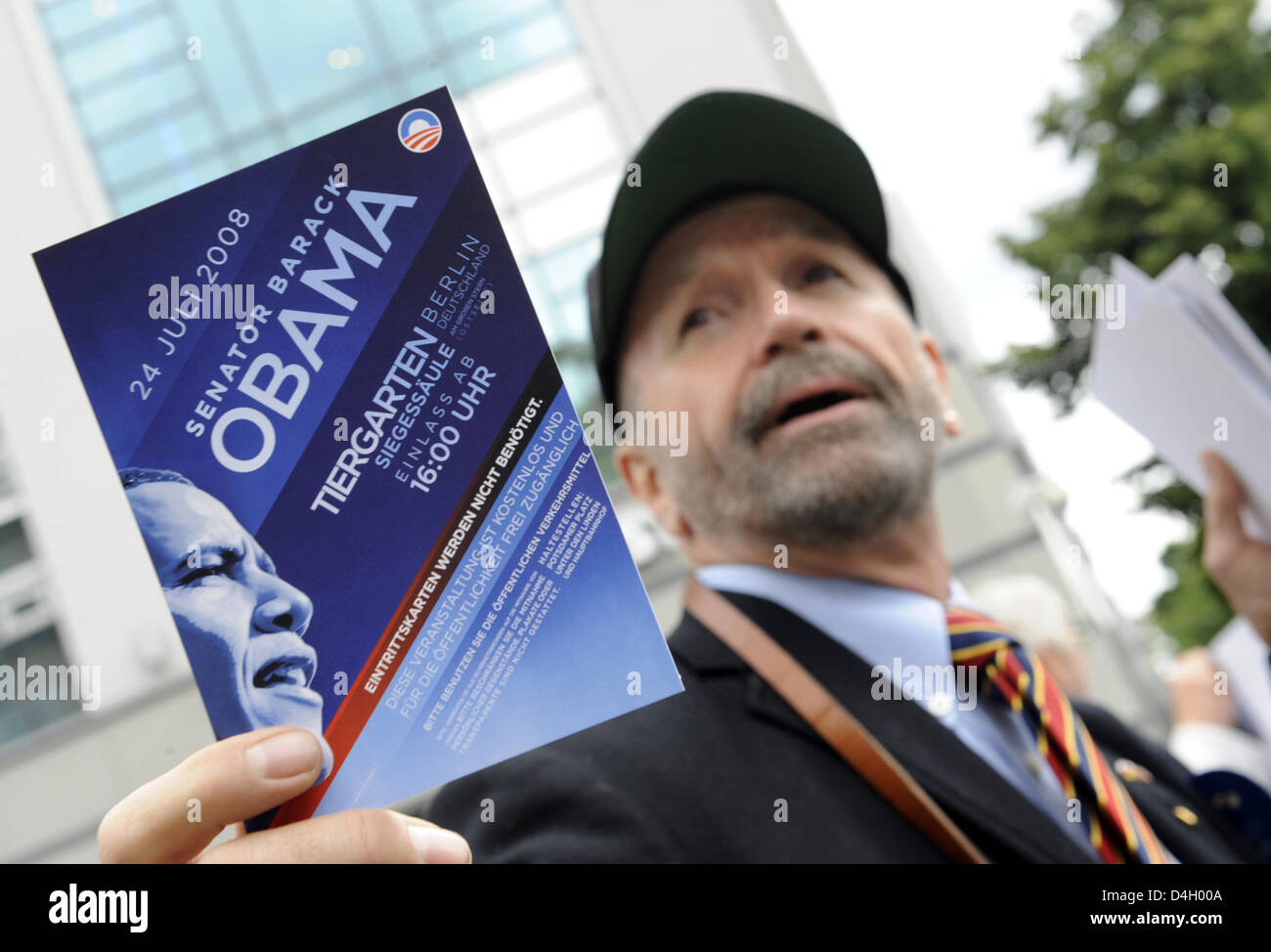 A party supporter of the American Democrats hands out flyers informing ...