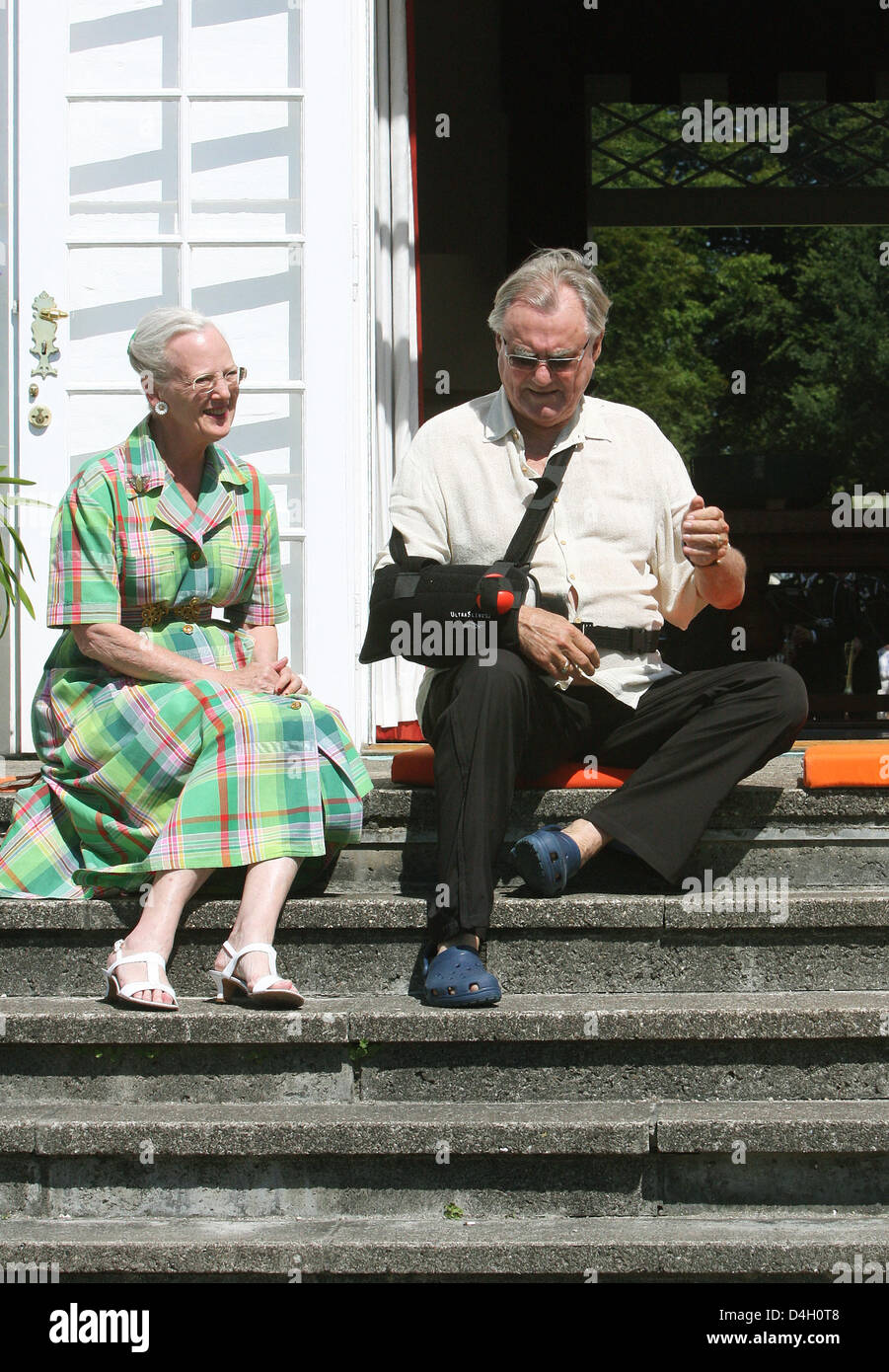 Danish Queen Margrethe and Prince Consort Henrik sit in the sun ouside ...