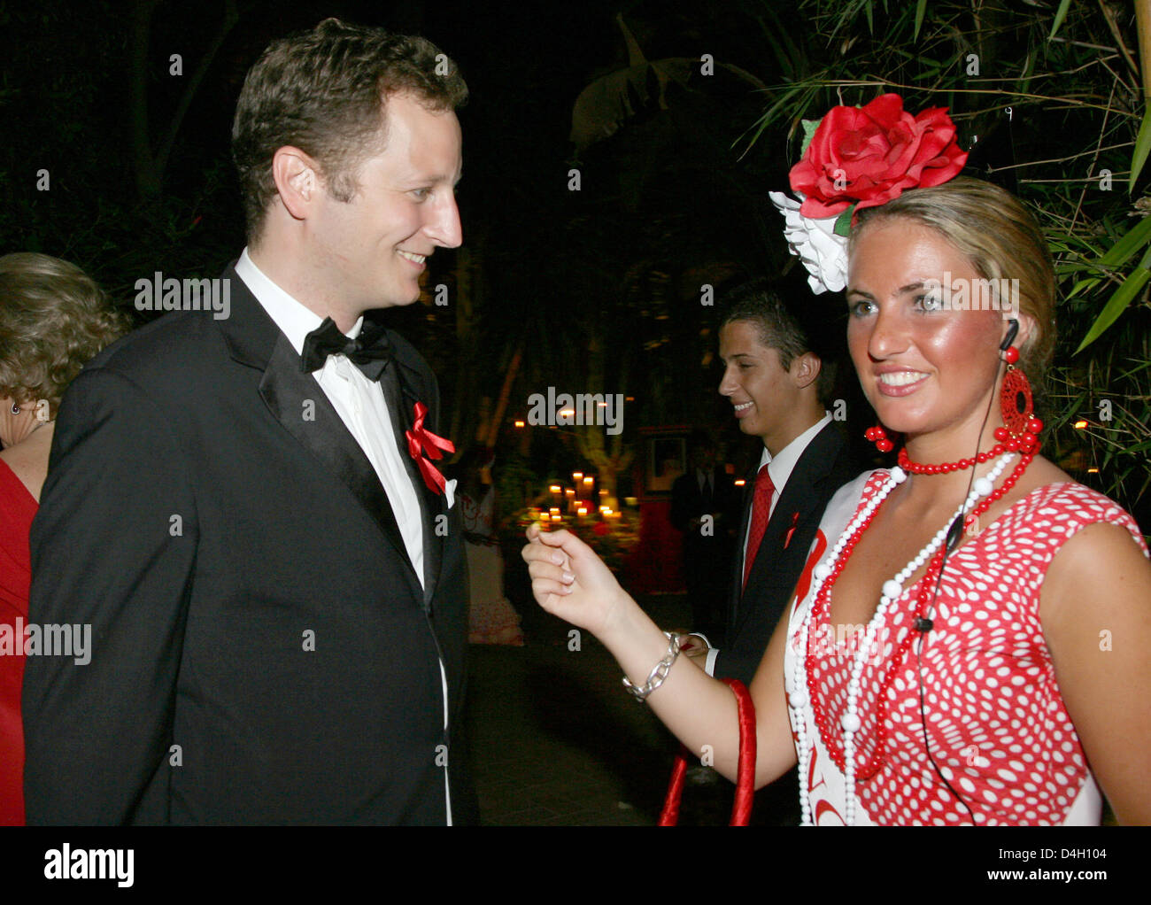 Prince Georg Friedrich of Prussia talks to a Spanish hostess at the ...