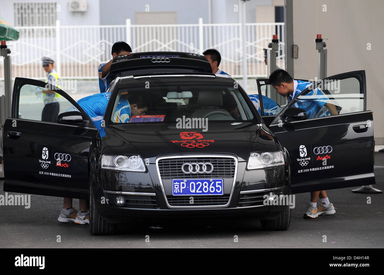 Security forces check a car at the entrance to a security area in ...