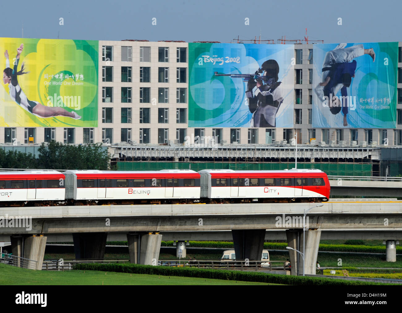 A subway drives past billboards advertising the Olympic Games at the ...