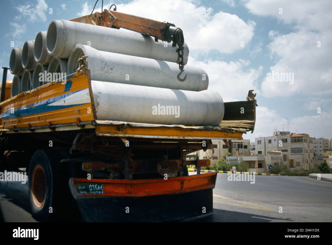 Truck carrying pipes hi-res stock photography and images - Alamy