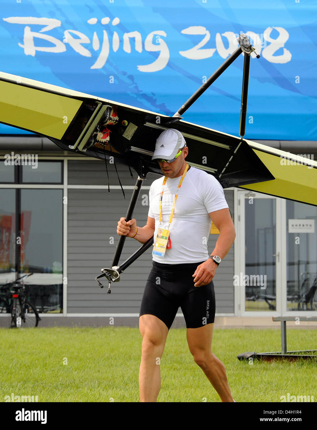 German rower Marcel Hacker brings his boat to the waters in Beijing ...