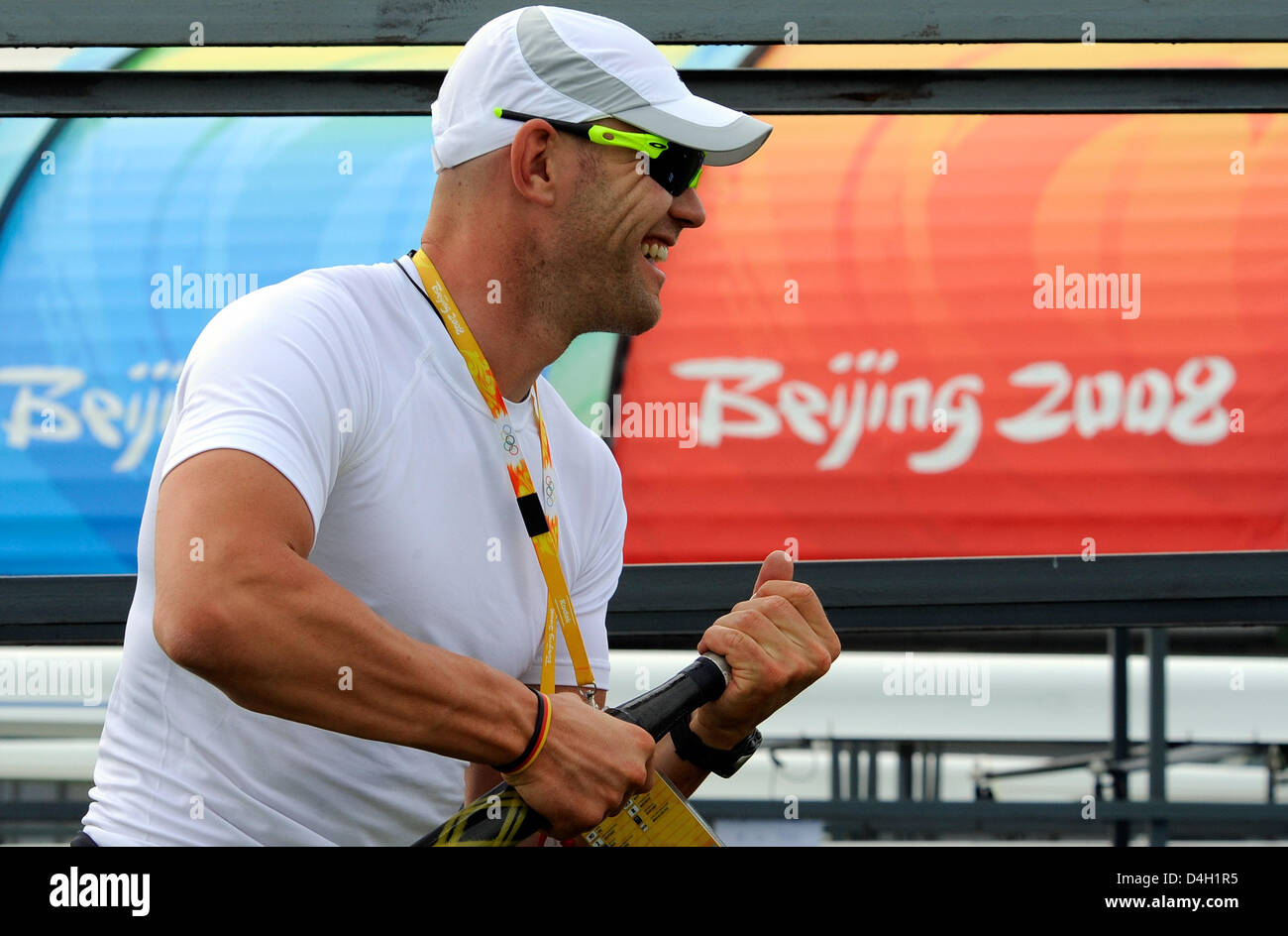 German rower Marcel Hacker brings his boat to the waters in Beijing ...