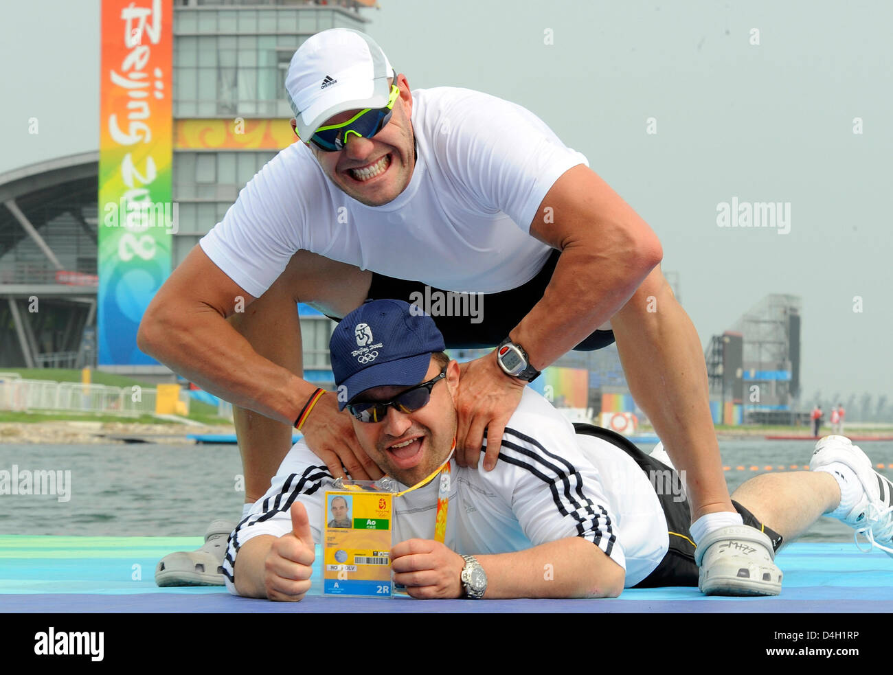 German rower Marcel Hacker (top) and his coach Andreas Maul joke at the ...