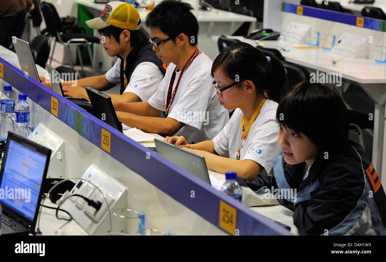 Japanese journalists work in the media centre of Beijing, China, 30 ...