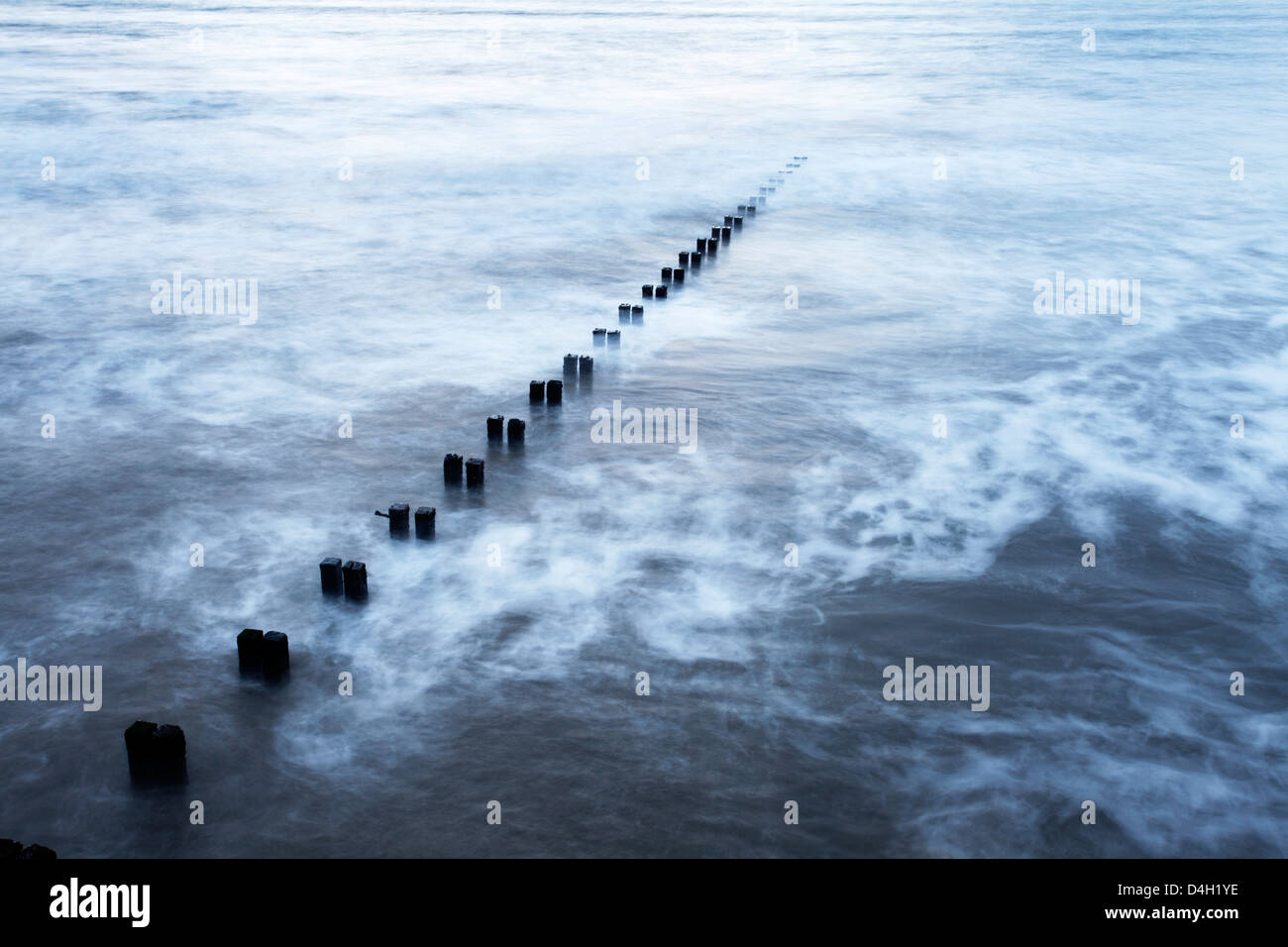 Groynes and incoming tide at Bridlington, East Riding of Yorkshire ...