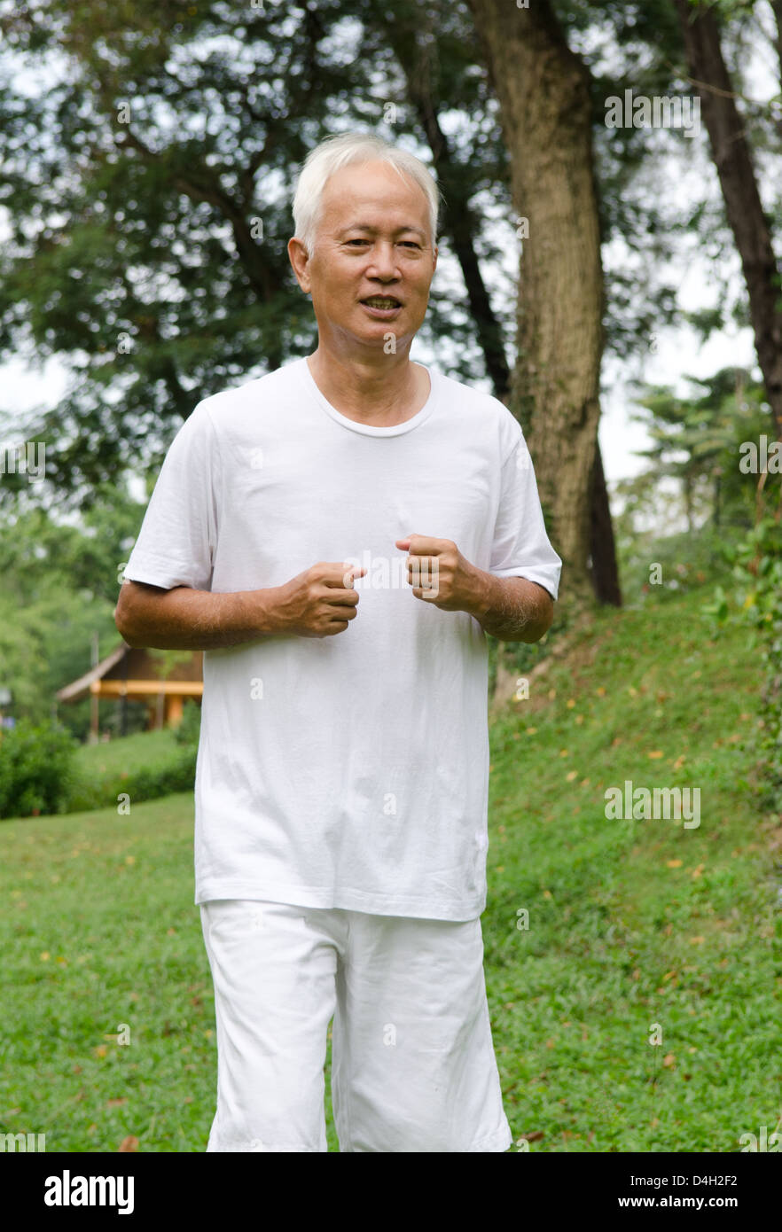 Asian senior male jogging hi-res stock photography and images - Alamy