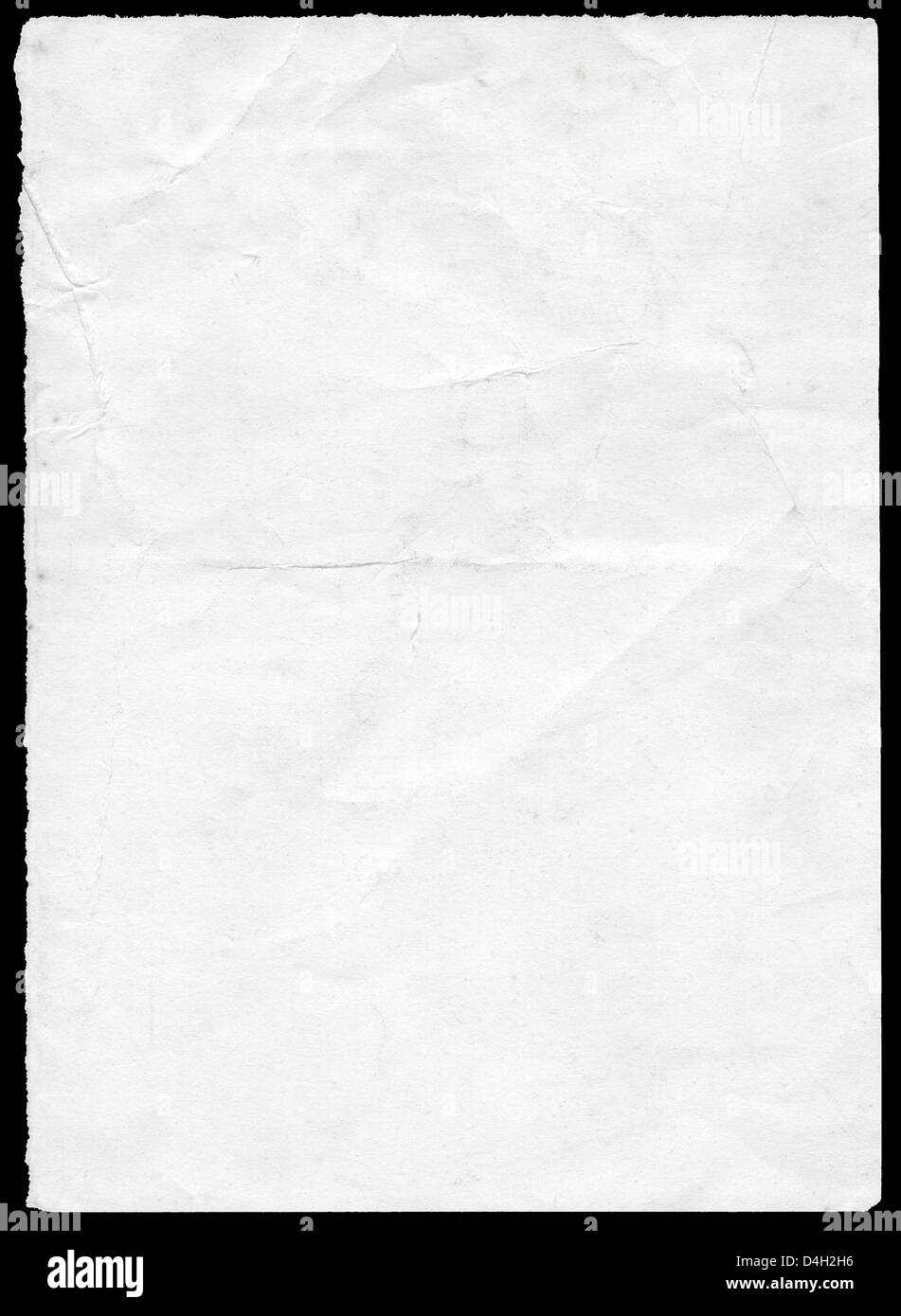 Dirty old piece of torn white paper isolated on black Stock Photo - Alamy