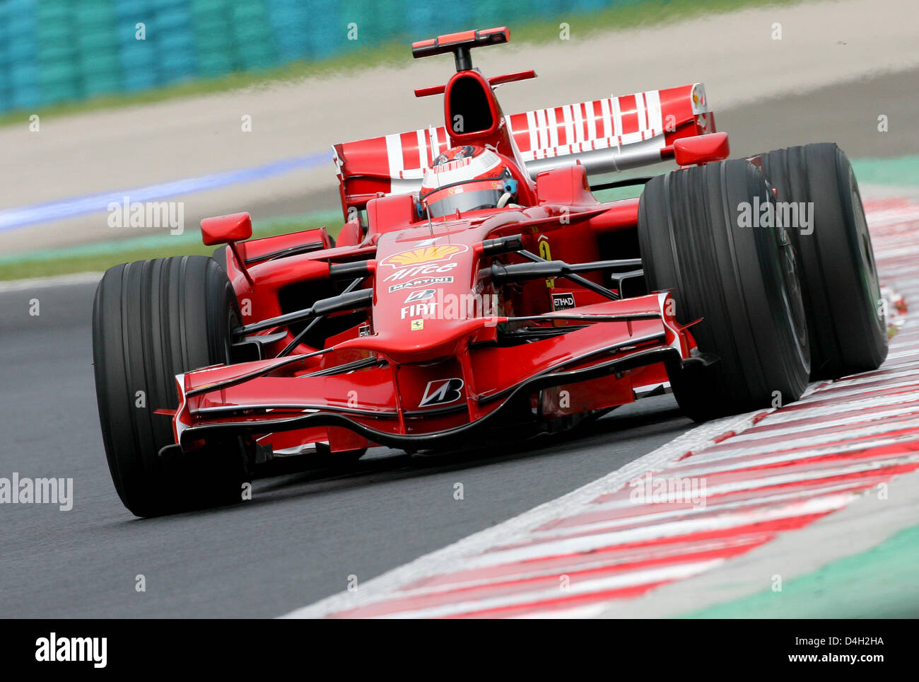 Finnish Formula One driver Kimi Raikkonen of Ferrari steers his car ...