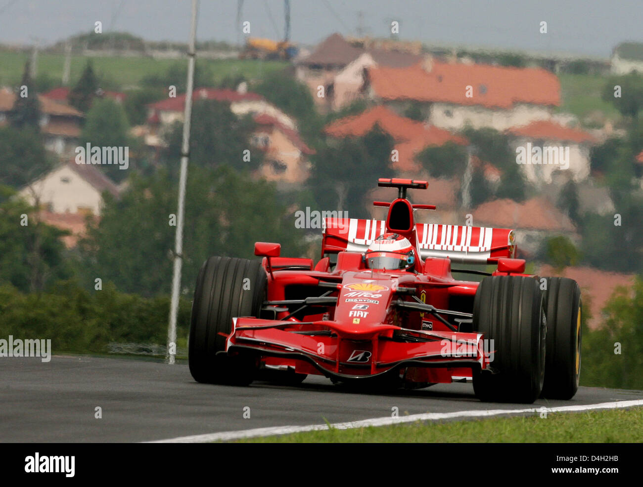 Finnish Formula One driver Kimi Raikkonen of Ferrari steers his car ...