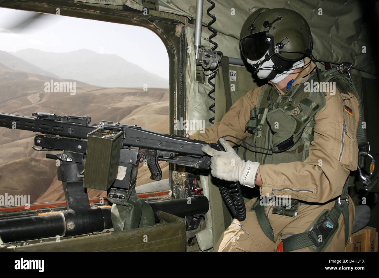 A Bundeswehr soldier secures the area as doorgunner of a CH 53 ...