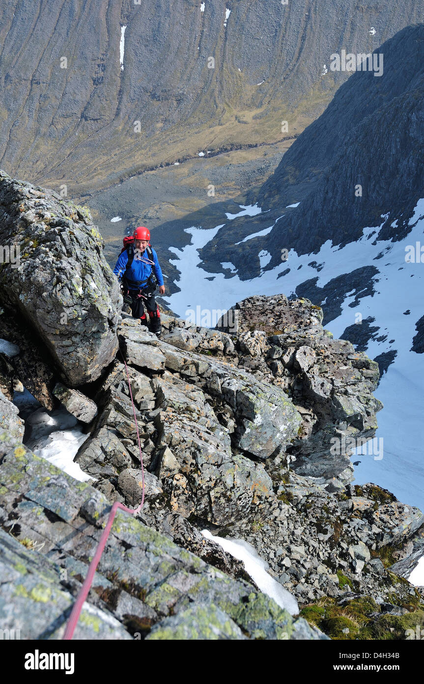 Climber ascending the Great Tower on Tower Ridge, Ben Nevis, a classic ...