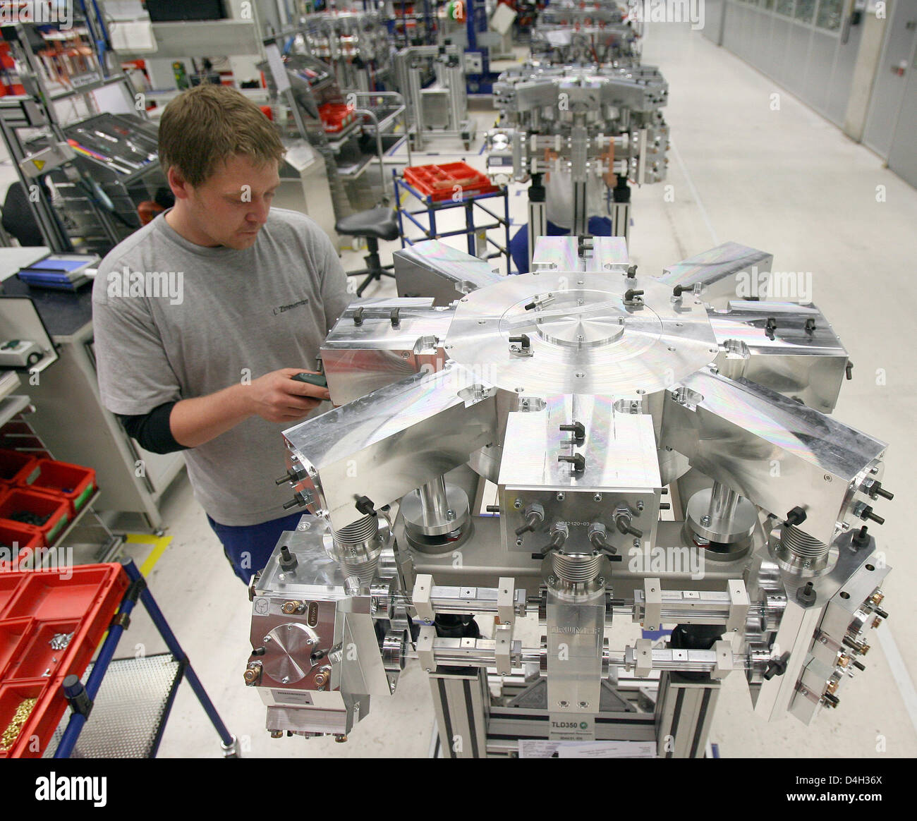 Industrial mechanic Ingo Zimmermann crafts laser cavities which make up ...