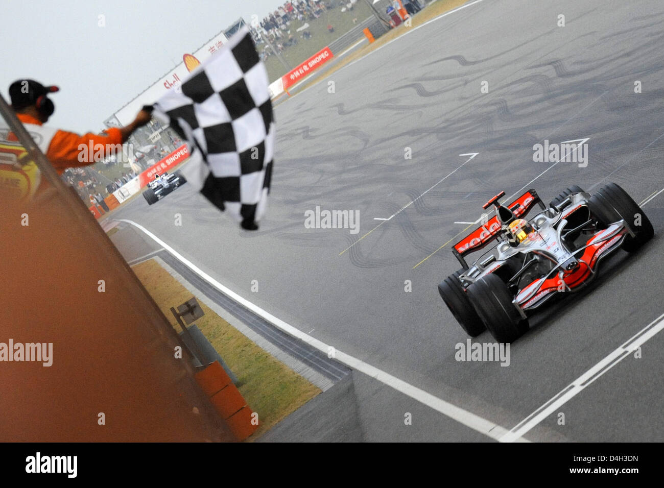 British Formula One driver Lewis Hamilton of McLaren Mercedes crosses ...