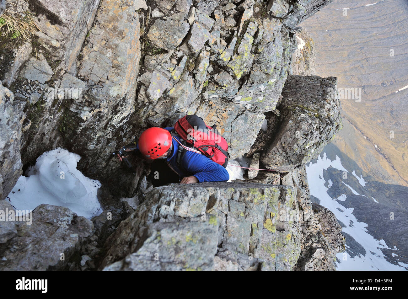Climber ascending the Great Tower on Tower Ridge, Ben Nevis, a classic ...