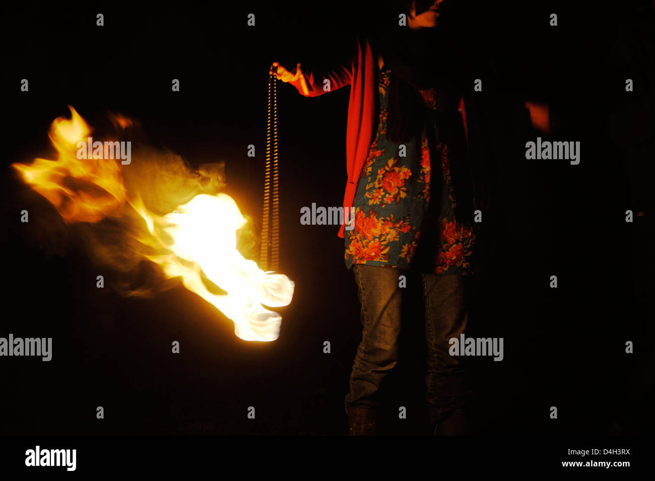 Person with poi hi-res stock photography and images - Alamy