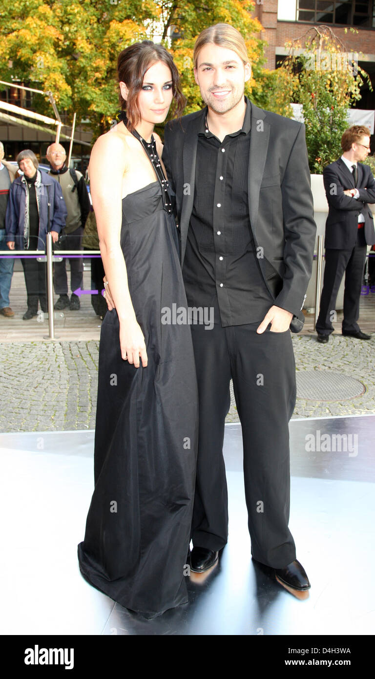 Violinist David Garrett and his girlfriend Tatjana Gellert pose during ...