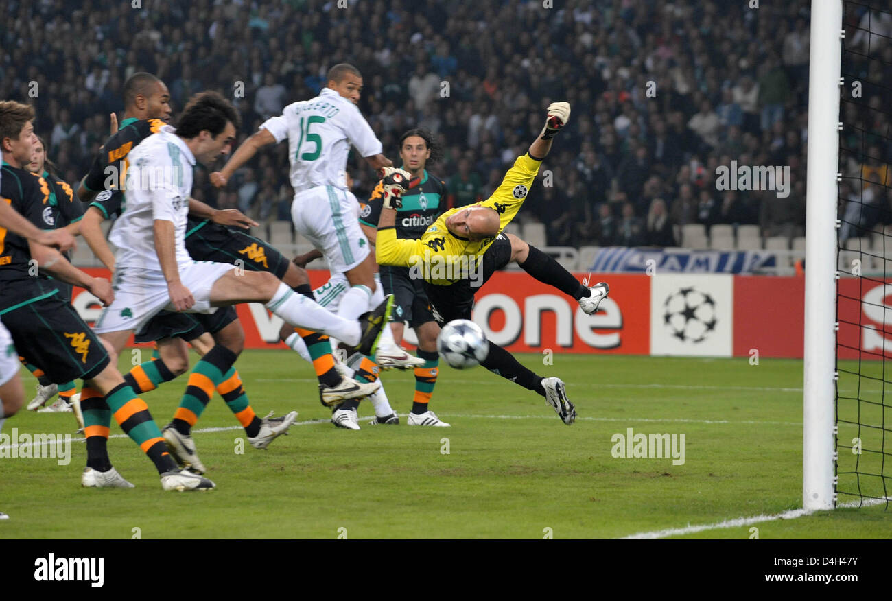 Werder Bremen goalkeeper Christian Vander (R) is shown in action during ...