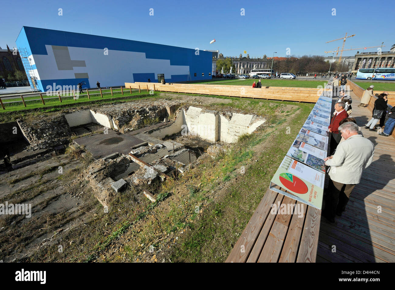 Onlookers at the newly designed sqare 'Schlossplatz' take a look at ...