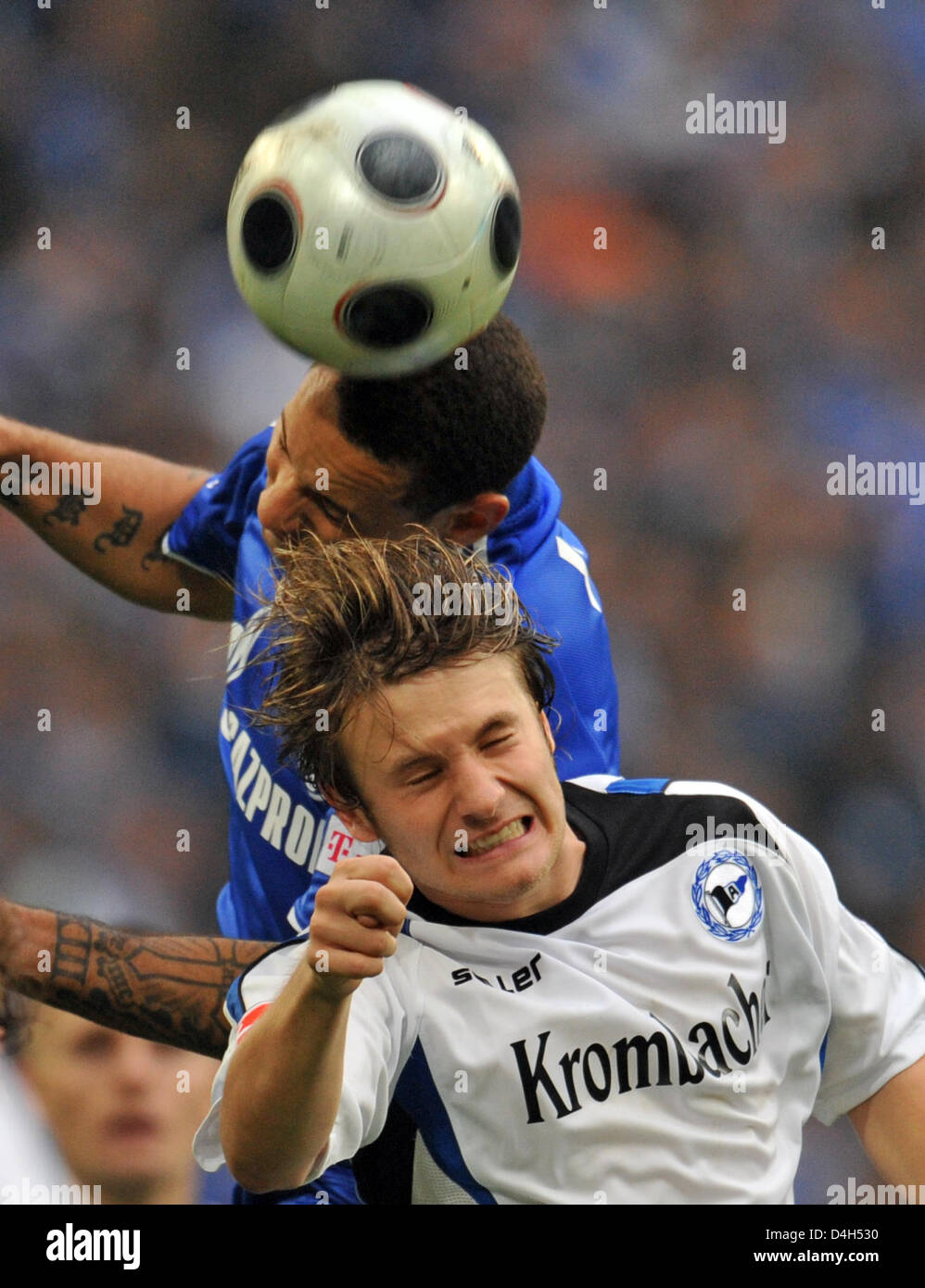 Schalke's Jermaine Jones (top) and Bielefeld's Daniel Halfar vie for ...