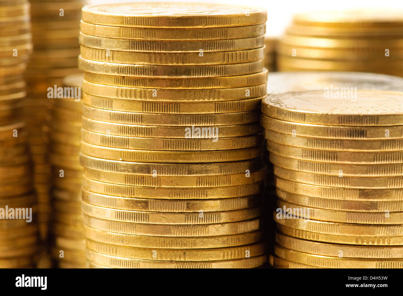 Stacks of coins. Isolated on white background Stock Photo - Alamy