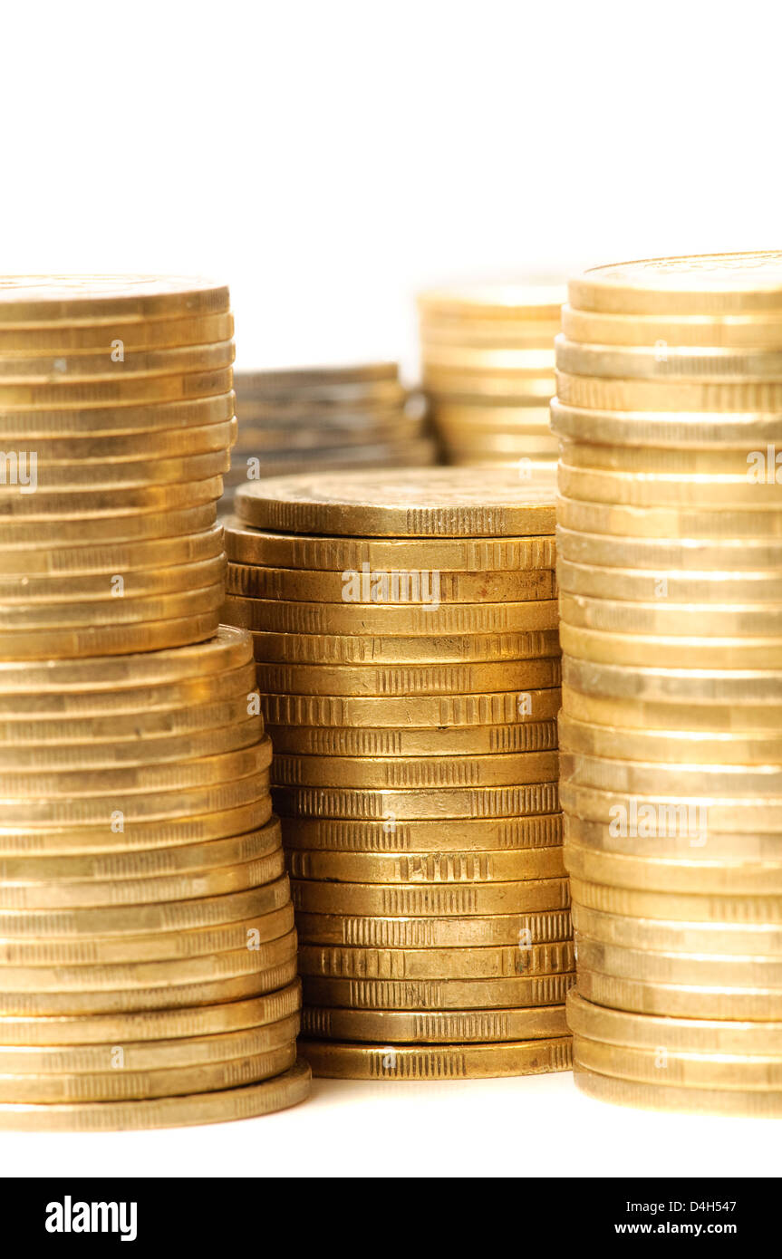 Stacks of coins. Isolated on white background Stock Photo - Alamy