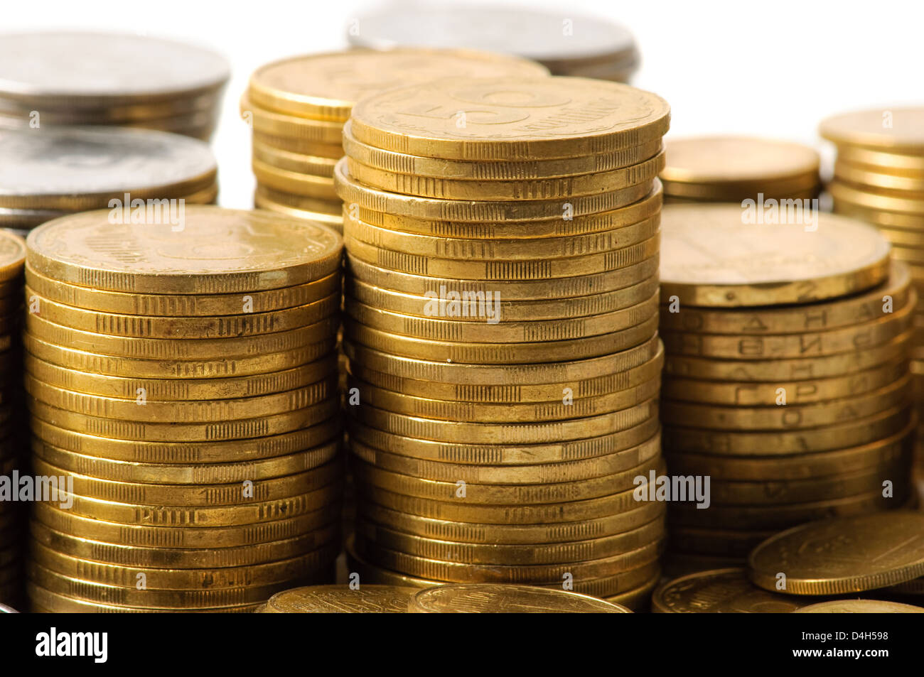 Stacks of coins. Isolated on white background Stock Photo - Alamy
