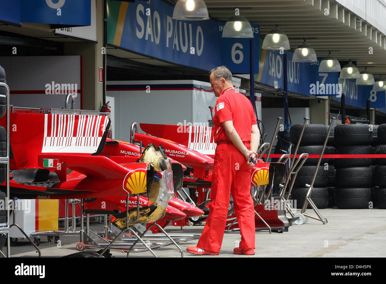 A team member of Ferrari stands in the pit lane as the Formula One ...