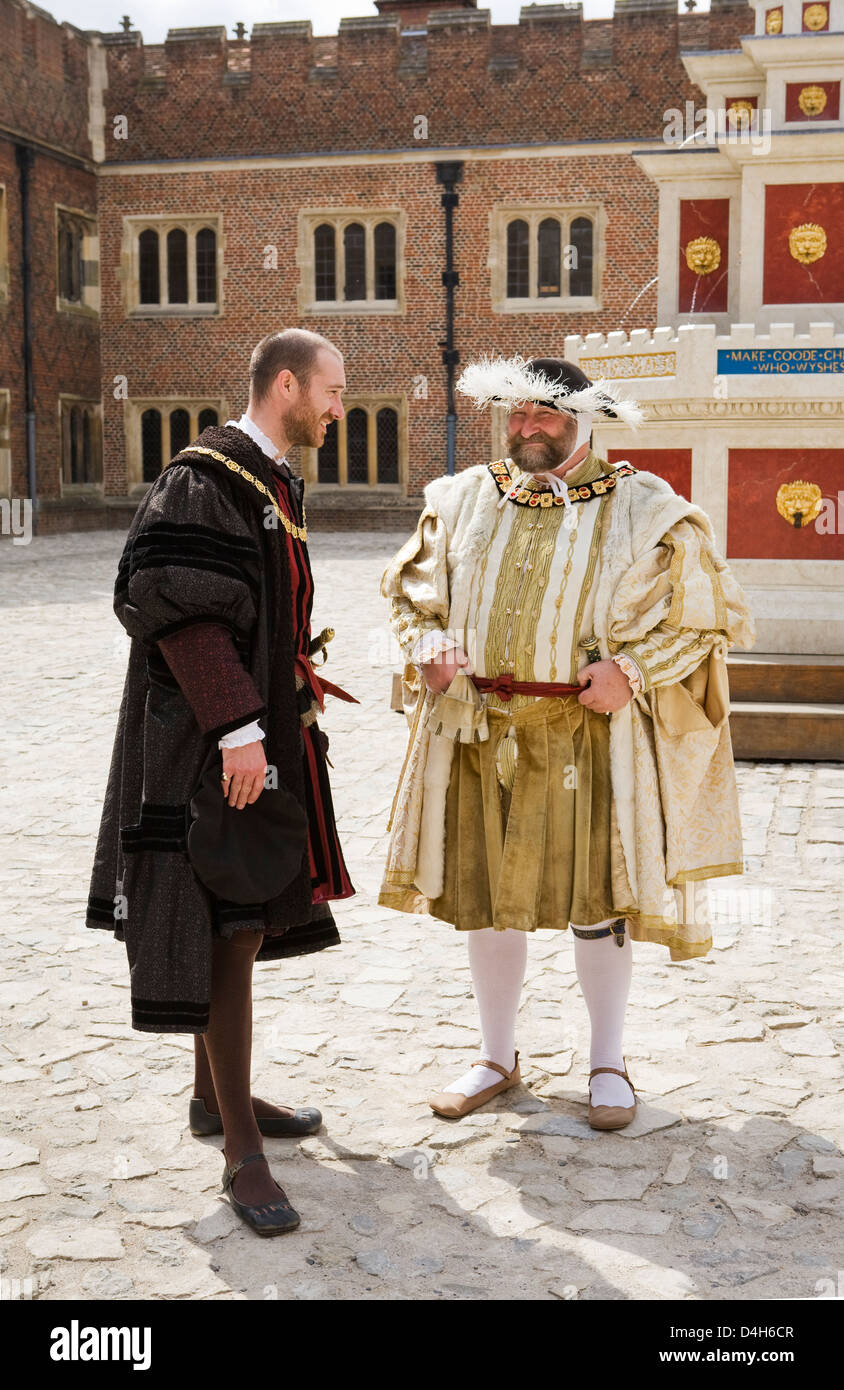 King Henry VIII confers with a courtier, portrayed by actors, in the ...