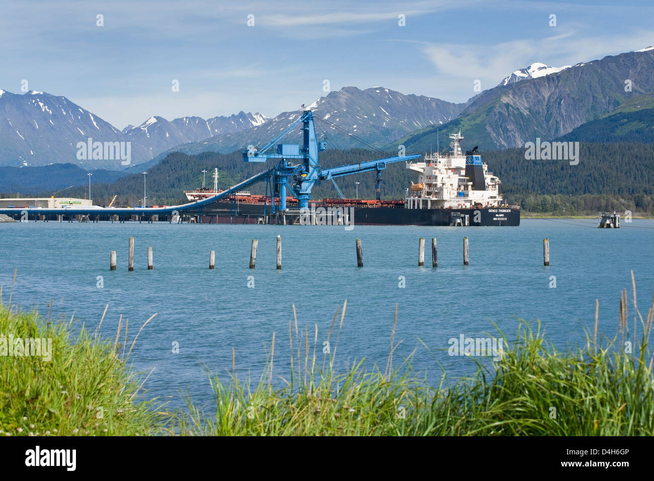 Bulk freighter ("bulker") being loaded with coal via conveyor belt ...