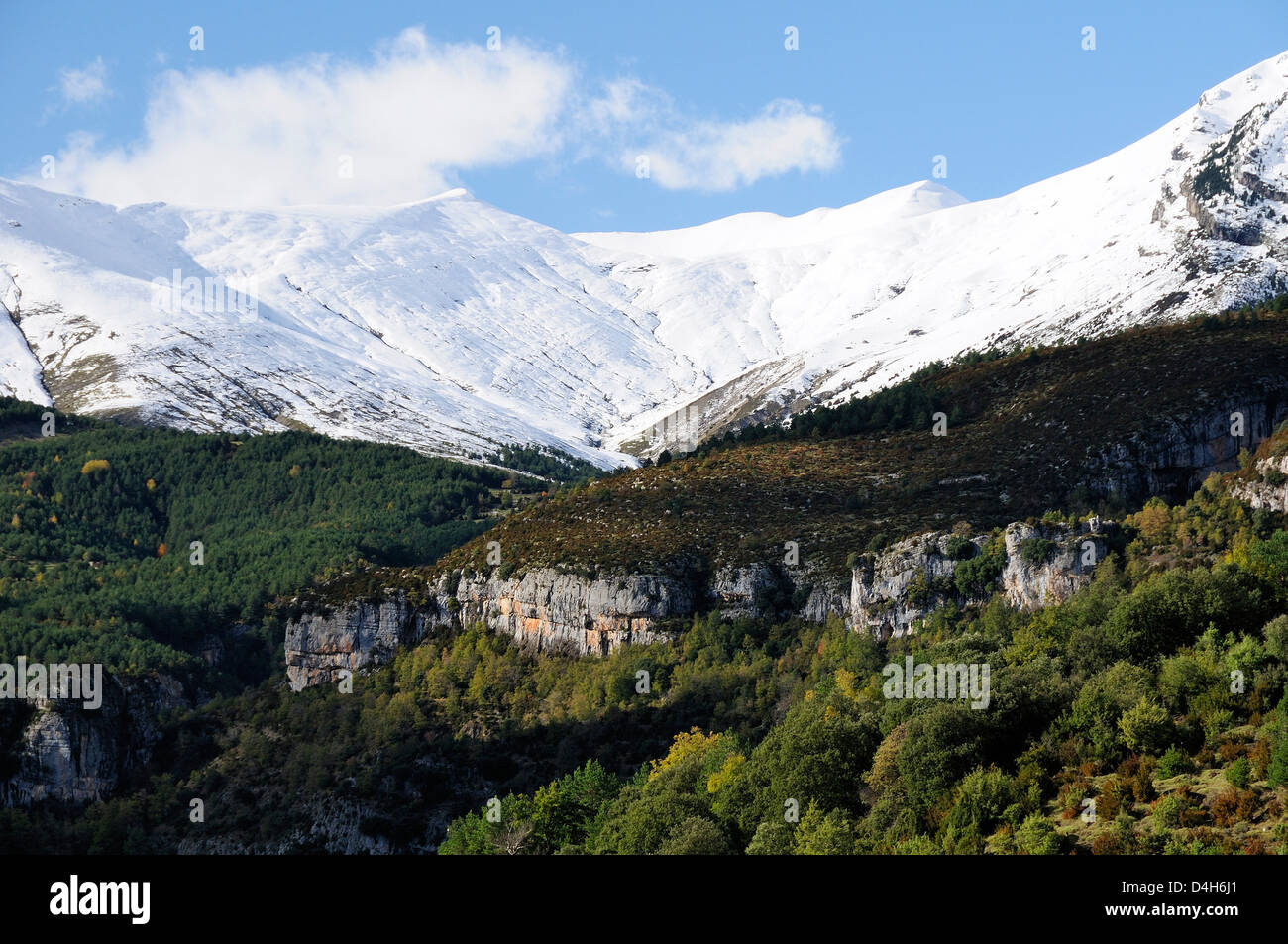 Limestone escarpments above Escuain gorge with snow covered high ...