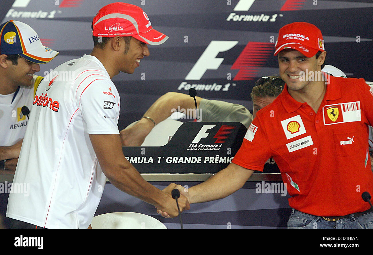 Brazilian Formula One driver Felipe Massa (R) of Ferrari and British ...