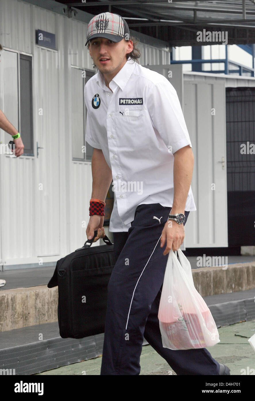 Polish Formula One driver Robert Kubica of BMW Sauber arrives at the ...