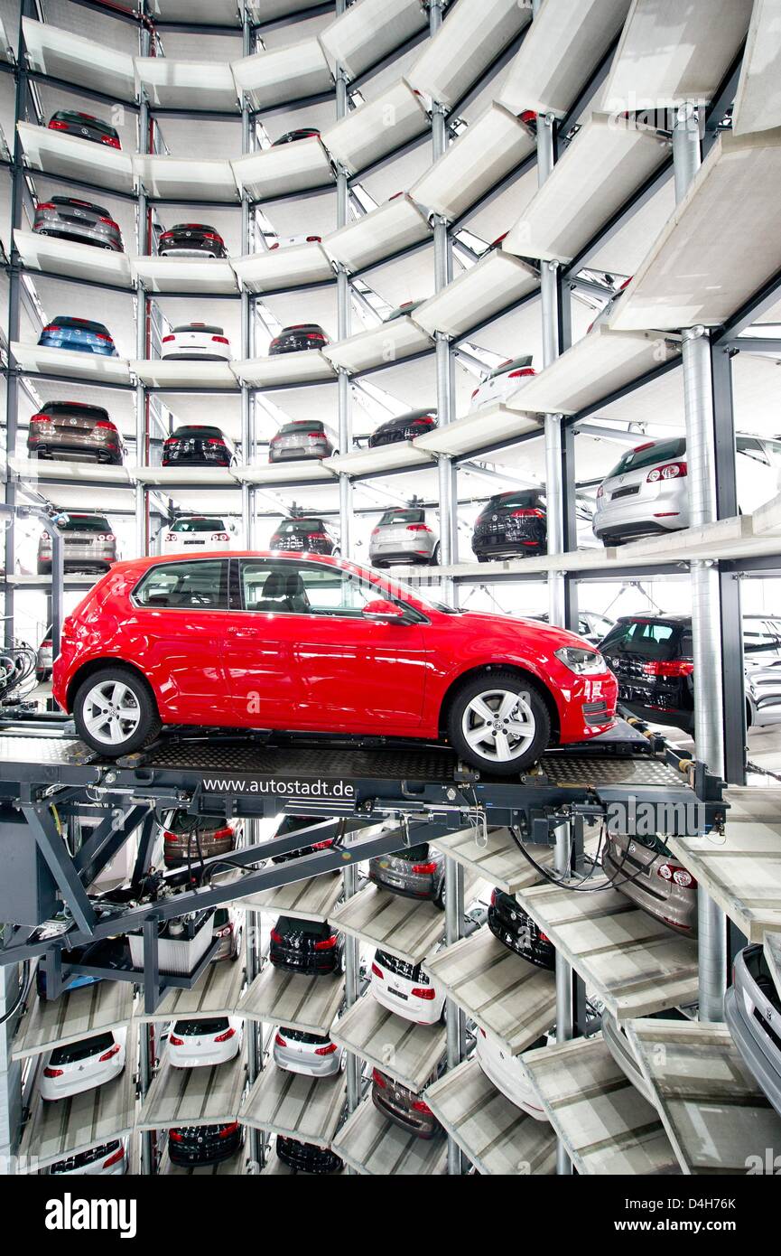 A Golf VII are picked by an automatic elevator to be transported out of ...