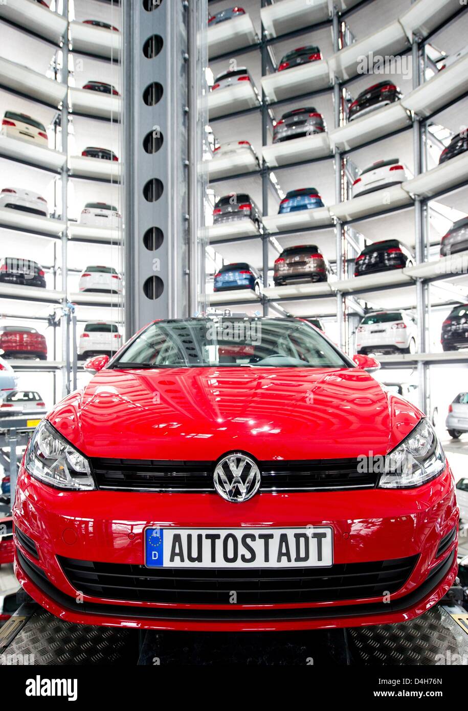 A Golf VII are picked by an automatic elevator to be transported out of ...