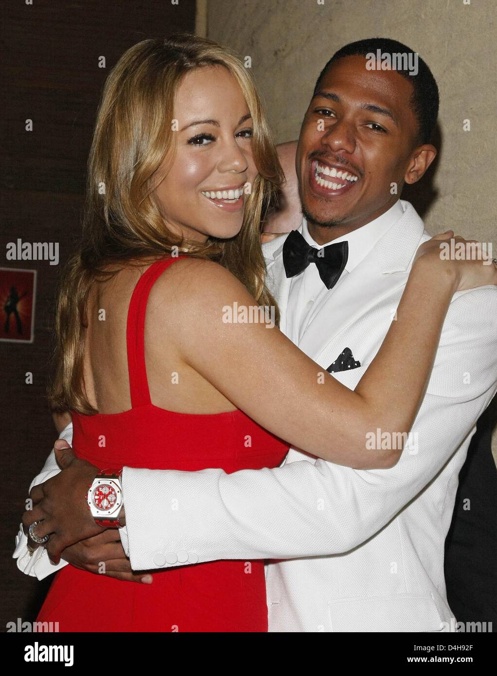 Singer Mariah Carey (L) and her husband Nick Cannon leave after the ...