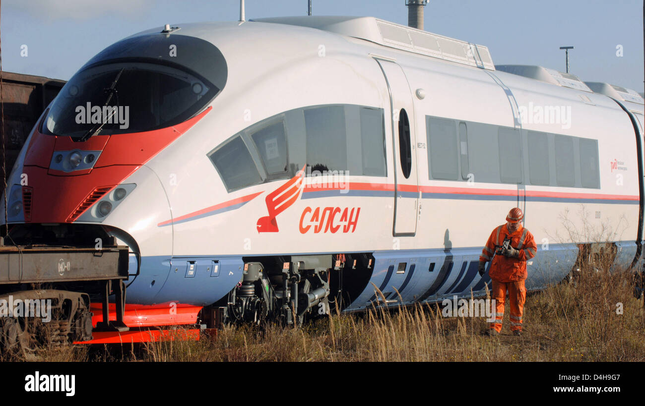 A worker checks the first Velaro RUS highspeed train to be delivered to ...