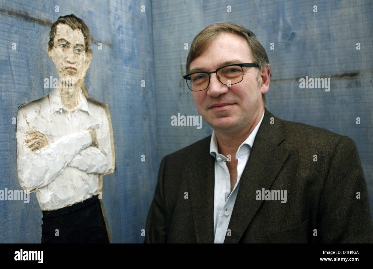 German sculptor Stephan Balkenhol poses in his work ?Sculpture - cross ...