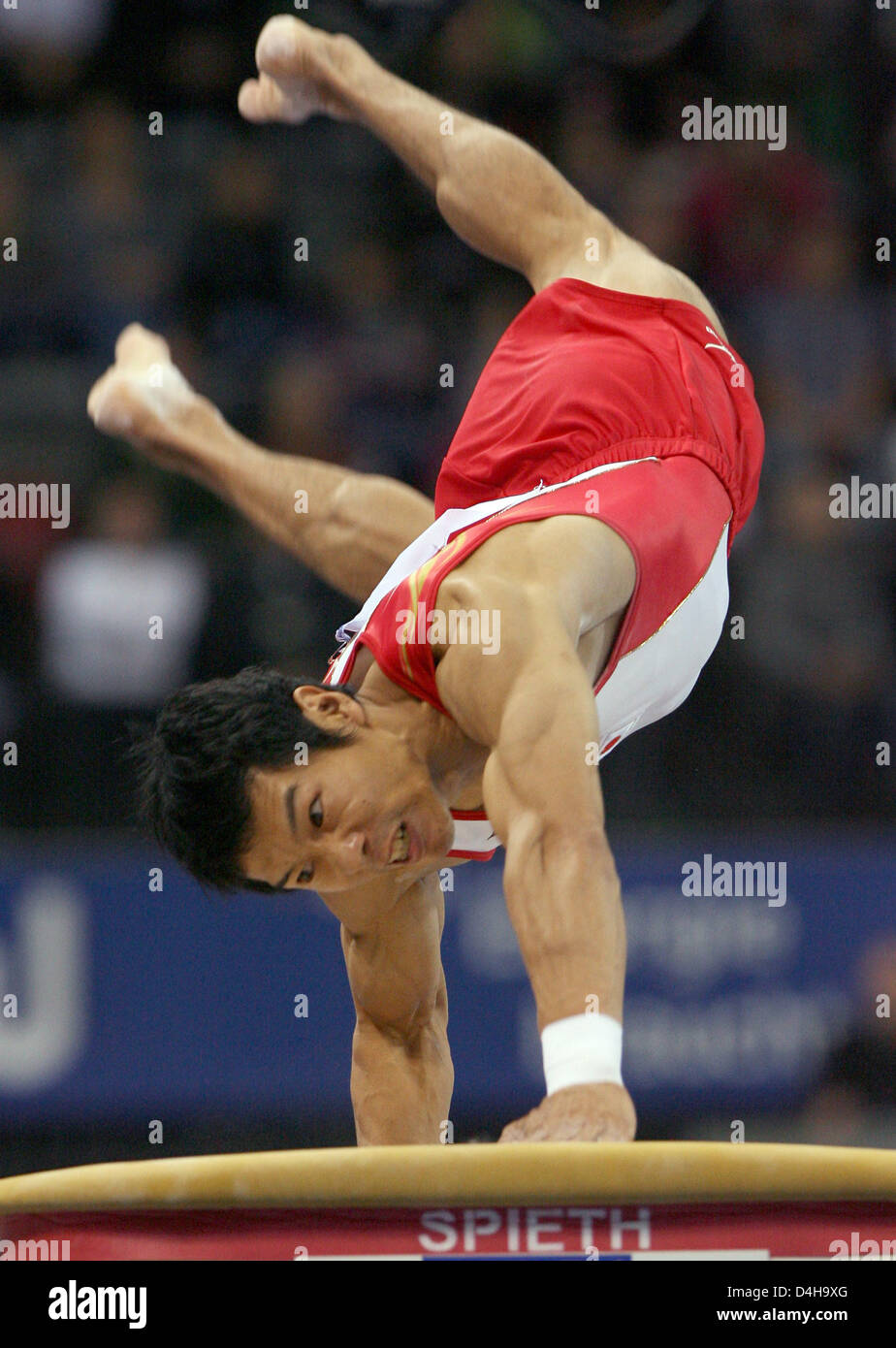Japanese artistic gymnast Hisashi Mizutori performs on the vault during ...