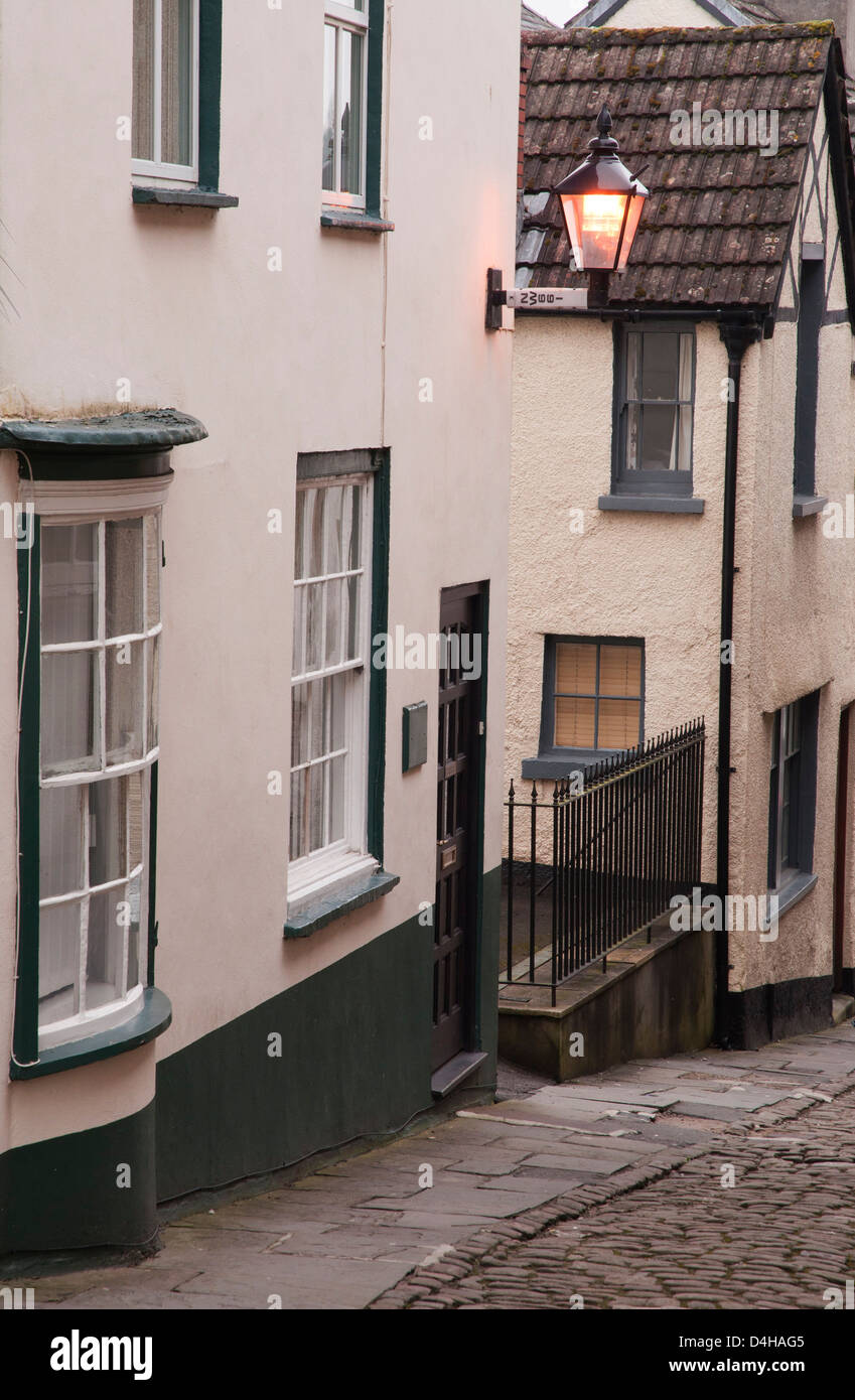 painted cottages in town back street, cobbles,bracketed street lamp ...
