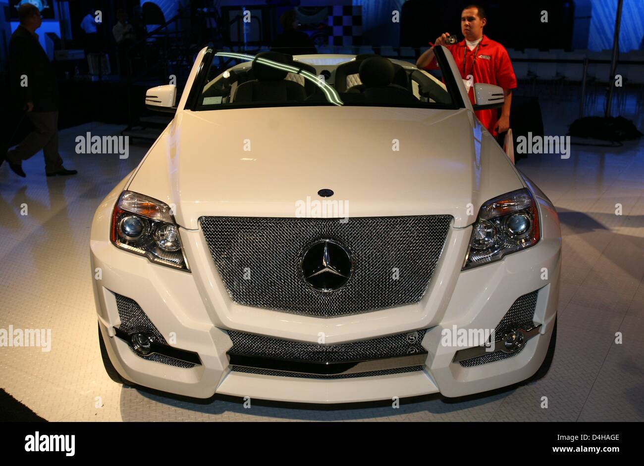A visitor examines a design study of the GLK model at the Mercedes ...